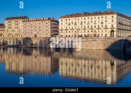 Po river in Turin city historical centre with water dam and green trees ...