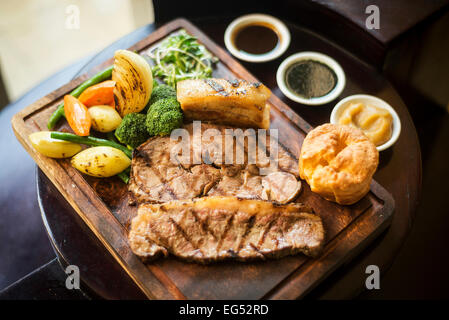 Traditional English Sunday lunch Roast Gammon with Yorkshire Pudding ...