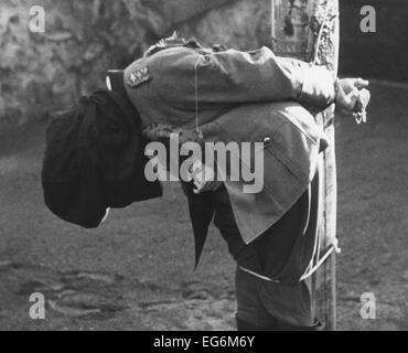 German General Anton Dostler’s body slumps after his execution by a ...