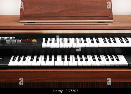 electric double keyboard wooden piano Stock Photo - Alamy