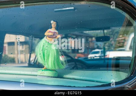Hawaiian Hula dancer car dashboard ornament in back window of old car ...