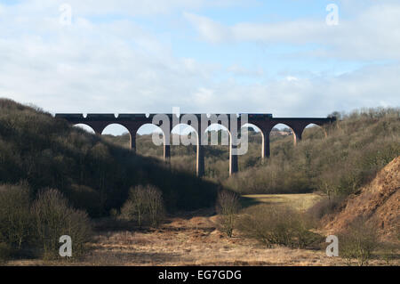 Freight train crossing the rail viaduct across the River Wansbeck near ...