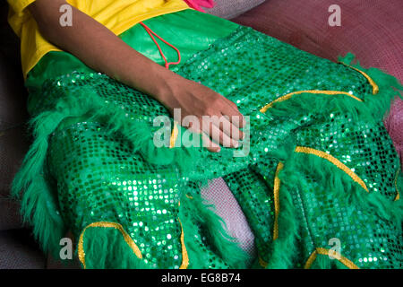 A man wearing a traditional Khmer costume is marching in a parade on a ...