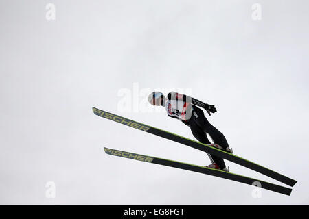 Rune Velta of Norway soars through the air the mens' normal hill ...