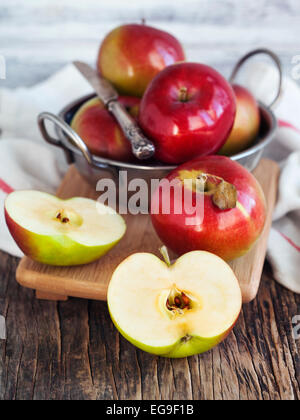 A group of apples on a cutting board Stock Photo - Alamy