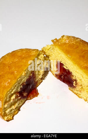 Jam Doughnut with jam oozing out Stock Photo - Alamy