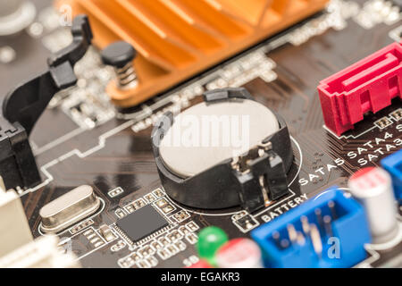 Lithium Battery Coin On Computer Motherboard Stock Photo - Alamy