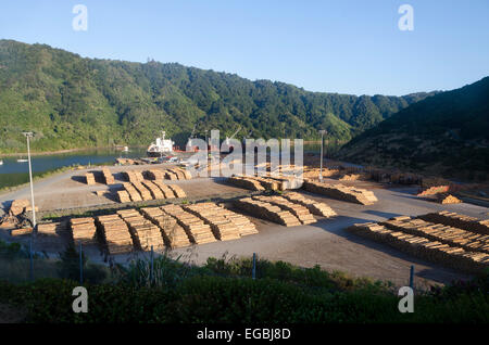 Logs on wharf, awaiting loading onto ship, Picton, Marlborough, South ...