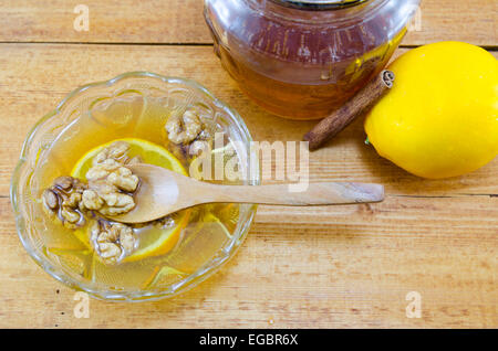 Honey, lemon and walnuts Stock Photo - Alamy