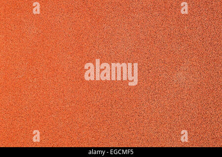 Stadium running track surface closeup background. Interesting textures ...