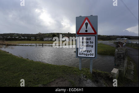 road liable to flooding sign, pictured surrounded by flood water, in ...