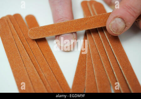 Man filing his nails Stock Photo - Alamy