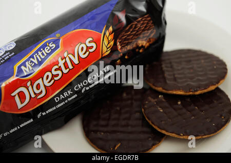 Opened packet of McVitie's milk chocolate Digestives biscuits set on ...