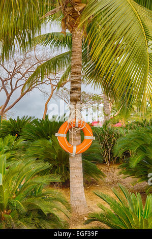 Life rings stand at the ready along the beach at a Caribbean resort ...