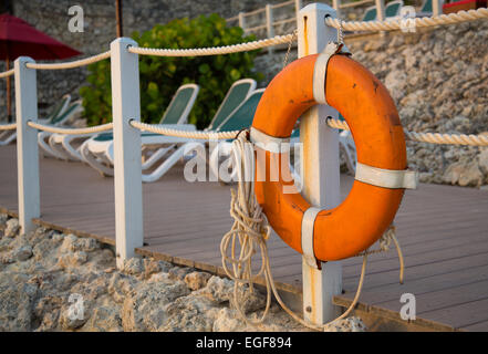 Life preserver ready at a beach resort Stock Photo - Alamy