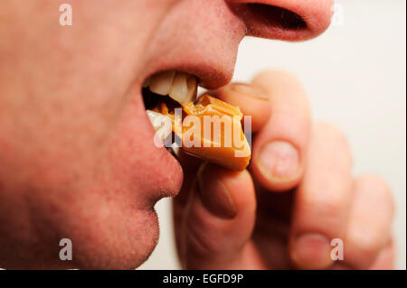 Male Eating Toffee Sweets Stock Photo - Alamy