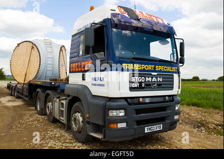 A low loader lorry delivering the hub of a wind turbine Stock Photo - Alamy