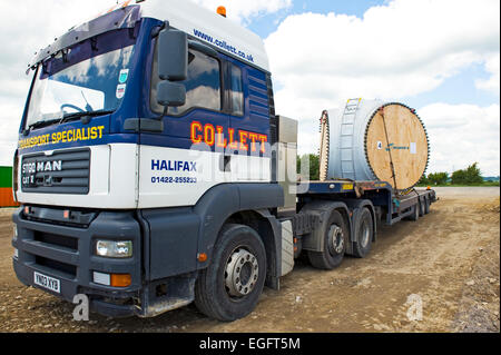 A low loader lorry delivering the hub of a wind turbine Stock Photo - Alamy