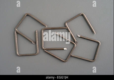 A group of large electrical cable tacks for heavy gauge wiring on a ...