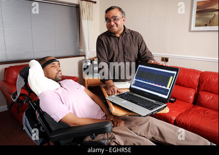 Richard Gregory has Locked-in Syndrome is pictured with a device which ...