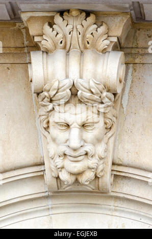 Face stone carved in limestone in Cueva de La Arena or Cave of the Sand ...