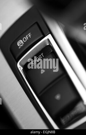 Detail of the "Sport Plus" mode switch in a car Stock Photo - Alamy