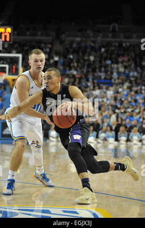 Washington guard Andrew Andrews moves the ball down the court during ...