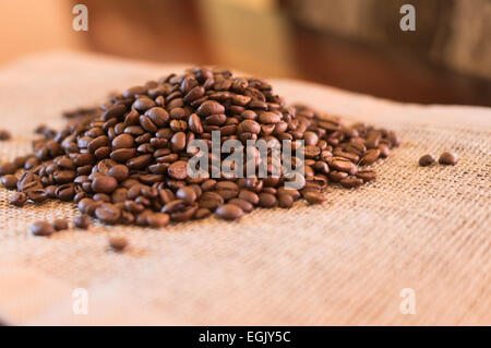 Coffee beans on tissue mat Stock Photo - Alamy