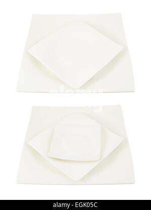 A stack of square white plates isolated on black background with copy ...