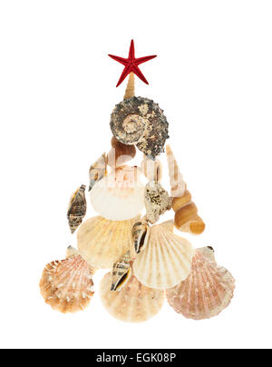 Christmas background with a Christmas tree made of seashells on a sandy ...