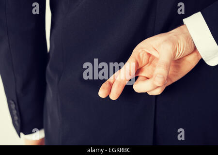 Crossed fingers. Liar sign. Fake promise. Unrecognizable dishonest ...