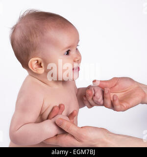 baby trying to stand up Stock Photo - Alamy