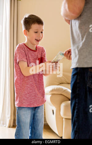 Father giving pocket money to his son Stock Photo: 72436622 - Alamy