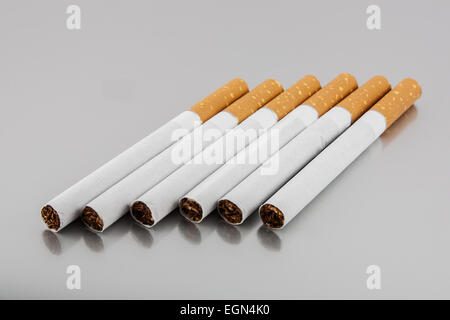 six filter cigarettes on the gray Stock Photo - Alamy