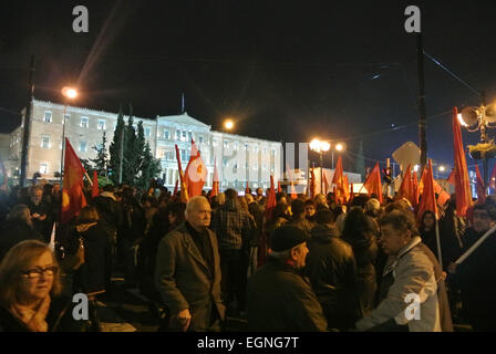 Athens, Greece. 27th February, 2015. A KKE supporter waves a red flag ...