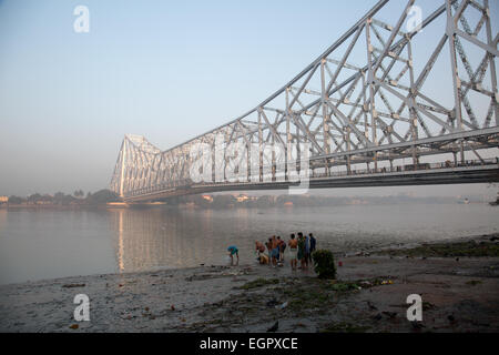People bathing at a Ghat at Howrah bridge, Kolkata, West Bengal, India ...