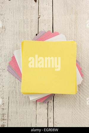 stack of paper with clip on wood background Stock Photo - Alamy