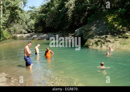 People cool off in a river as the National Weather forecaster issued an ...
