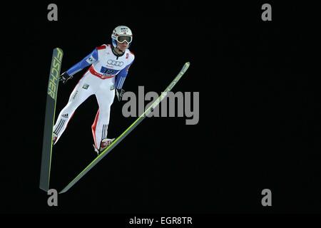 Rune Velta of Norway soars through the air the mens' normal hill ...