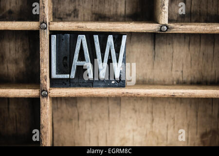 The word Law in old letterpress printing blocks isolated on a white ...