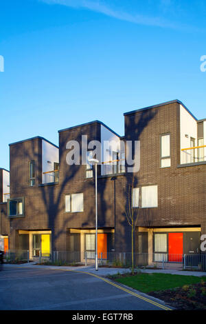 Front doors in development of houses, flats and a leisure centre by ...