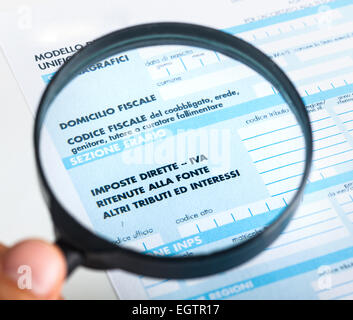 F24 for the tax return in Italy with magnifying glass Stock Photo - Alamy