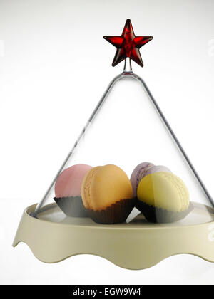 colorful macaron in the triangle glass container with star on top Stock ...