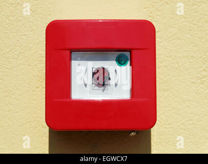 red fire alarm box on white background Stock Photo - Alamy