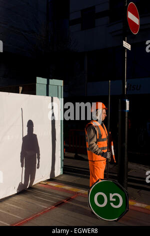 Construction site Banksman (Traffic Marshal) waits to control local ...