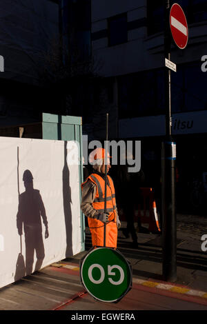 Construction site Banksman (Traffic Marshal) waits to control local ...