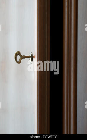Close-up of the partially open door of an old yellow school bus. The ...