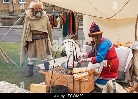 Woman cooking over an open fire in her basic rural village kitchen, The ...