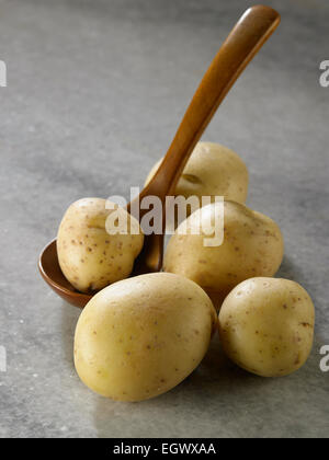 few potatoes on the kitchen top Stock Photo - Alamy