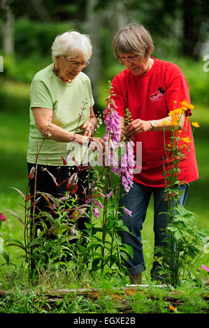 Mrs. Lil Punkari (age 86) discussing gardening issues with daughter ...